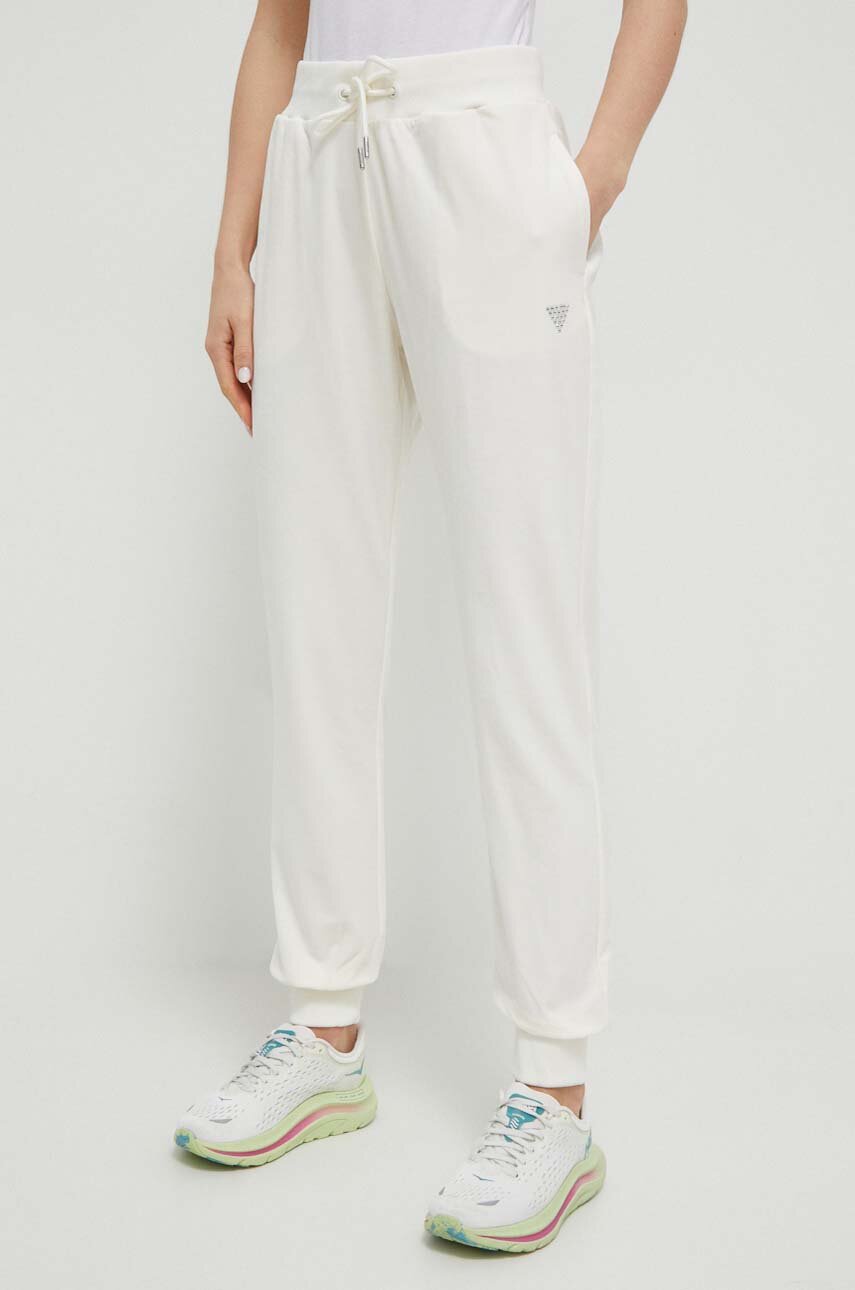 Tepláky Guess COUTURE béžová farba, s nášivkou, V3BB27 KBXI2 | ANSWEAR.sk